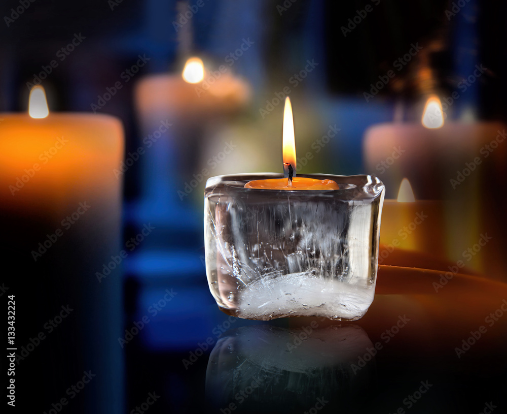 Glowing mourning candles. Stock Photo | Adobe Stock