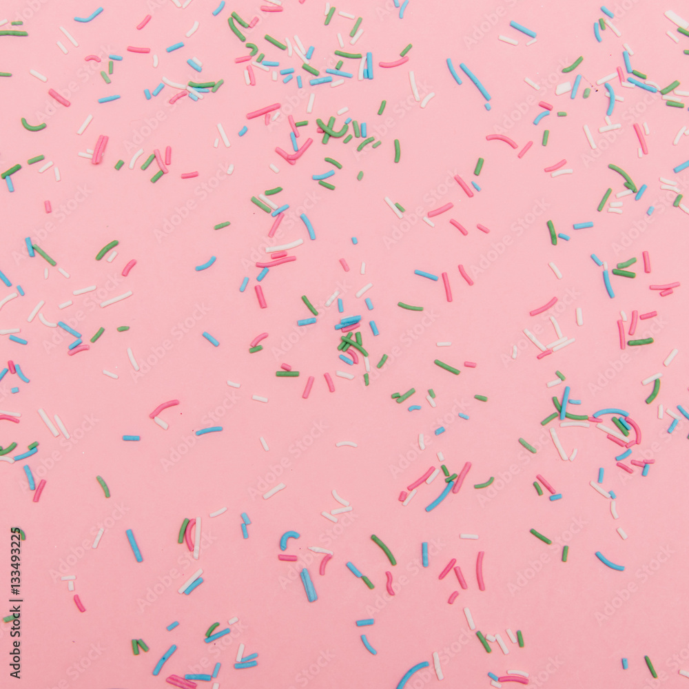 pattern of colorful sprinkles topping on pink background Stock Photo ...