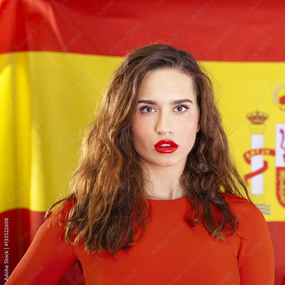 Young woman on the background of the Spanish flag Stock Photo | Adobe Stock