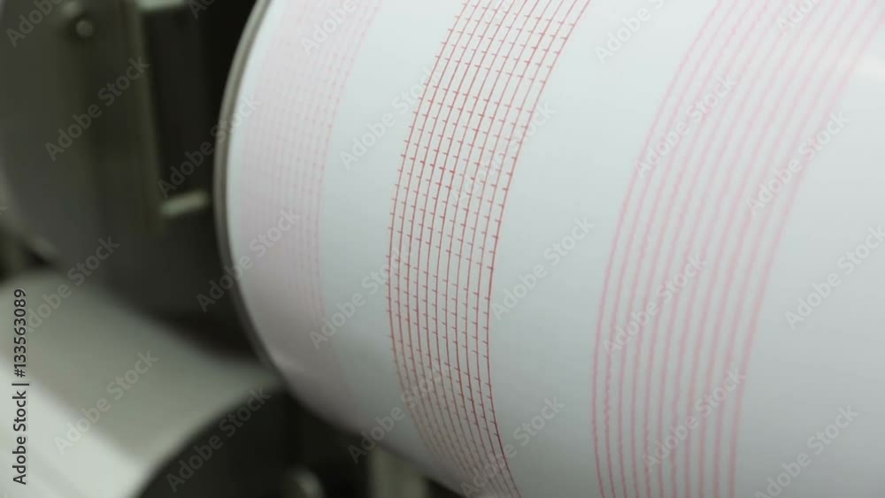 Seismograph records an earthquake on the sheet of measuring paper ...