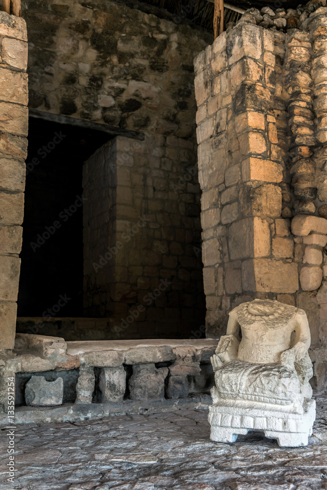 Ancient Mayan statue in one of the rooms of Acropolis in Ek Balam, a ...