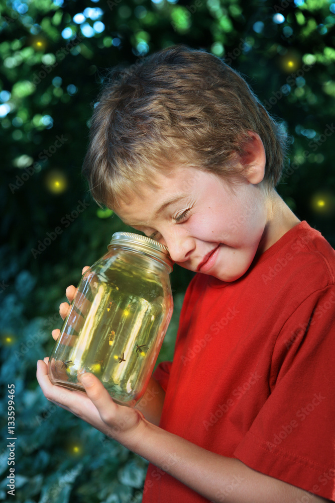 Boy with a jar of fireflies Stock Photo | Adobe Stock