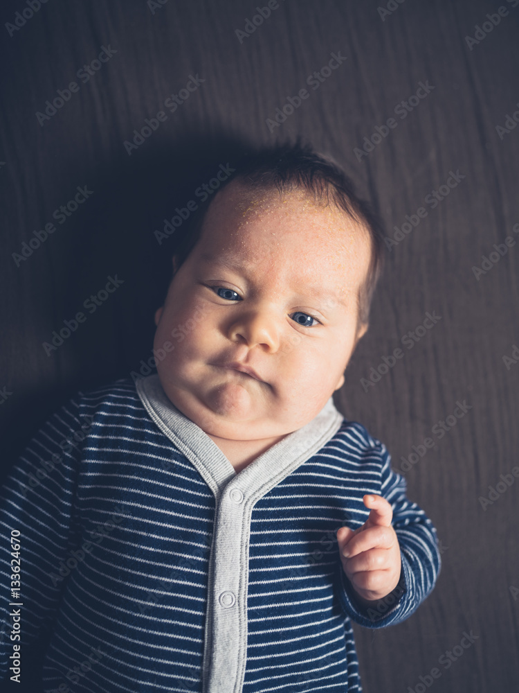 Little baby with his finger raised Stock Photo | Adobe Stock