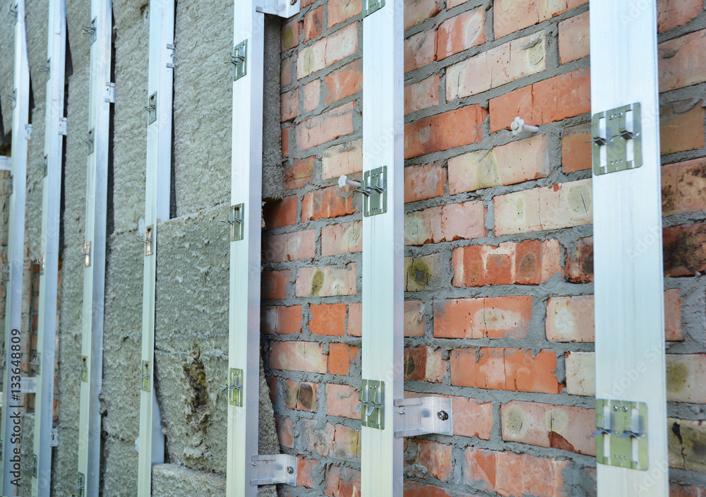 Insulating Construction. House brick wall insulation for energy saving ...