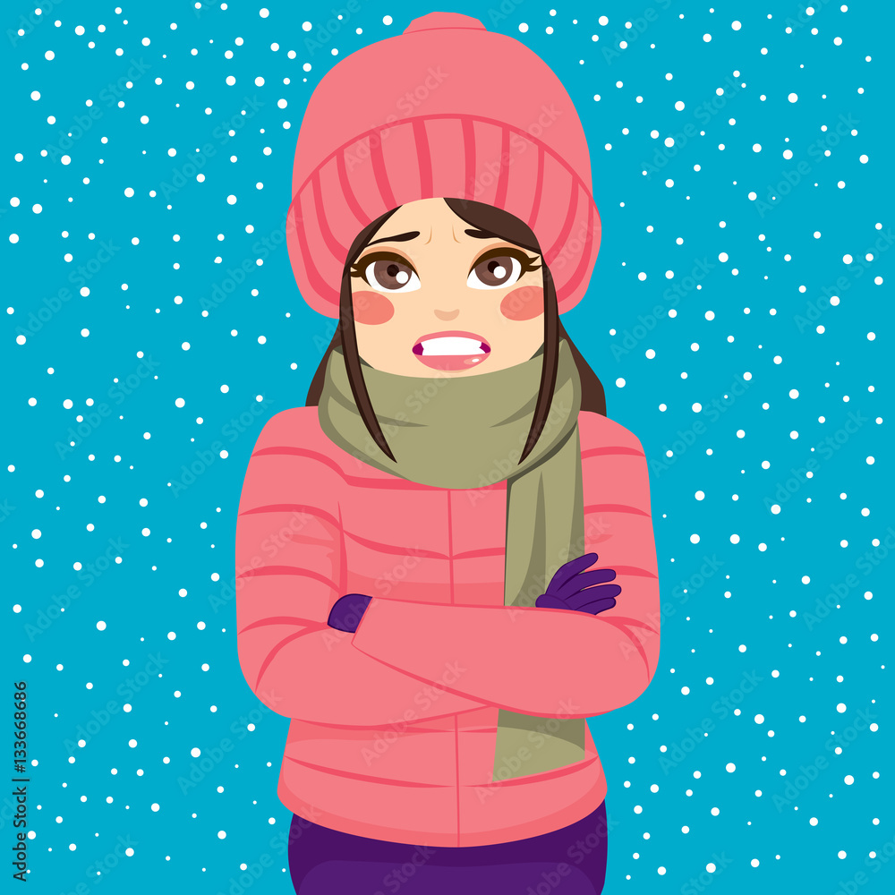 Woman shivering in cold winter outdoors wearing warm clothes on snowy ...