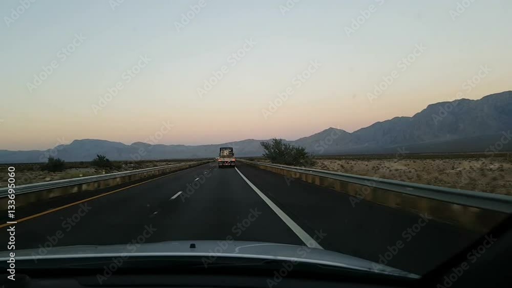 Vidéo Stock View from a car window, of a desert road on route 15, just ...