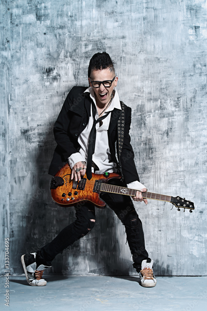 Foto Stock crazy rock musician | Adobe Stock