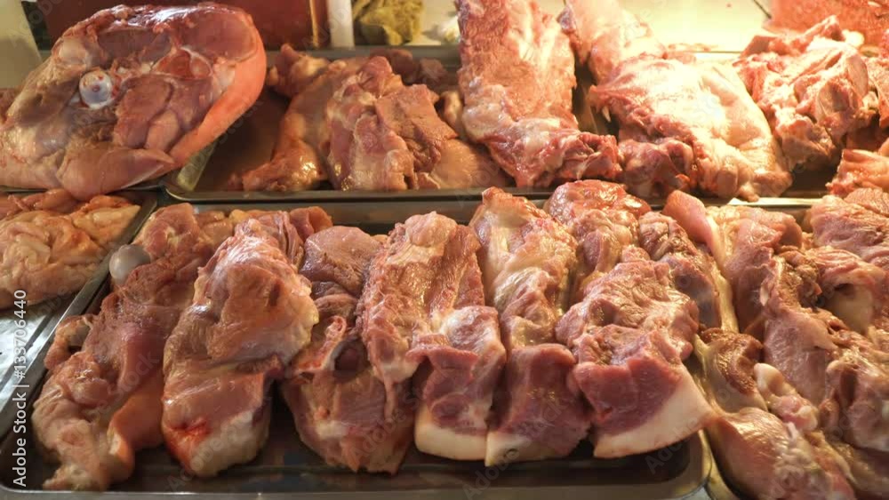 Meat in a street market. Meat from Asian market. Heap of fresh raw meat ...