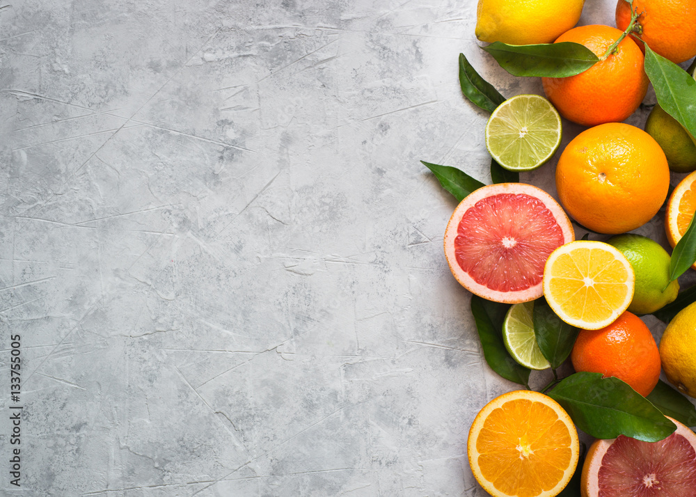 Citrus fruit on grey concrete table. Food background. Healthy eating ...