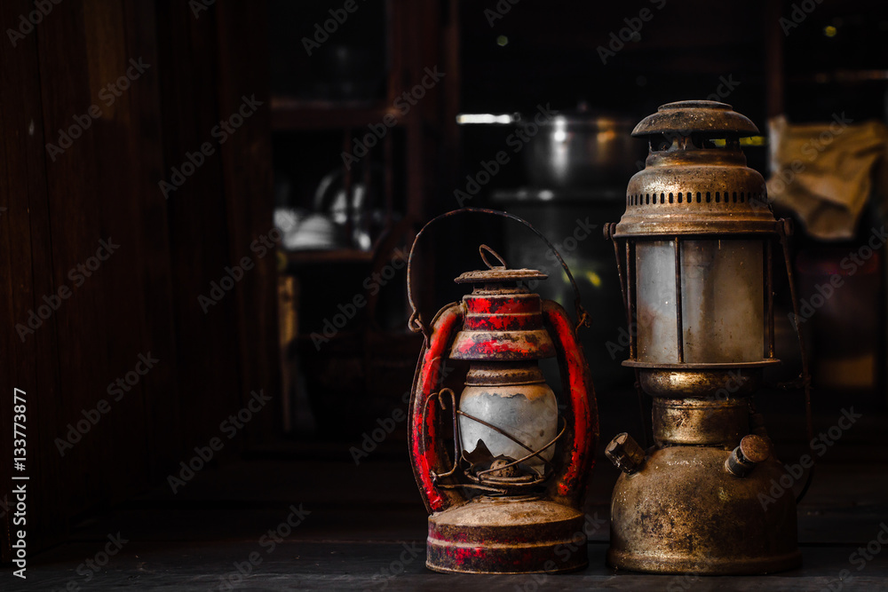 Old fashioned vintage kerosene oil lantern lamp burning with a soft ...