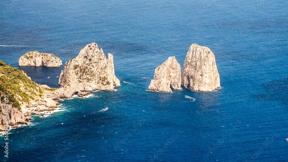Dangerous cliff rocks rises from the sea. Two hight cliff rocks with ...