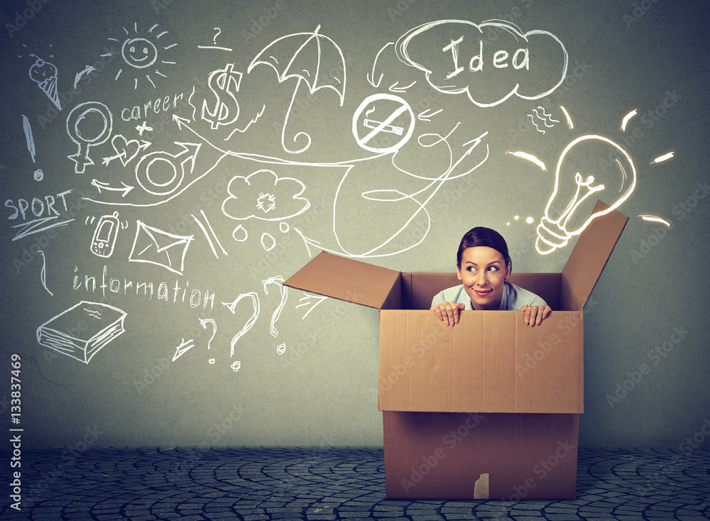 Think outside box. Young woman coming out of box Stock Photo | Adobe Stock