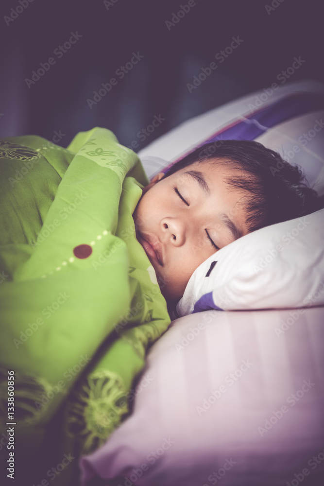 Healthy child. Little asian boy sleeping peacefully on bed. Vintage ...