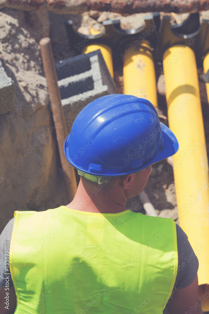 Real and ordinary construction worker on his job. Stock Photo | Adobe Stock