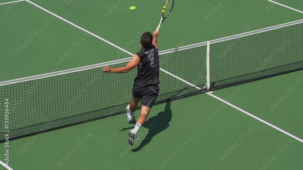 Tennis Player Volley's at net and turns to celebrate his success. Stock ...