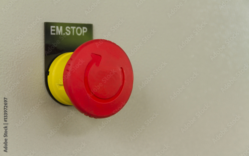 Red emergency stop and reset on control panel. Stock Photo | Adobe Stock