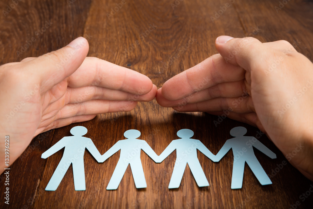 Person Hand Protecting Human Figure Cutout Stock Photo | Adobe Stock