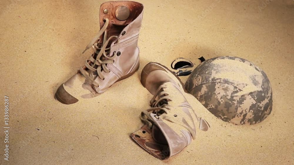 soldier hat boots and sand glass in the desert Wreck bulletproof helmet ...