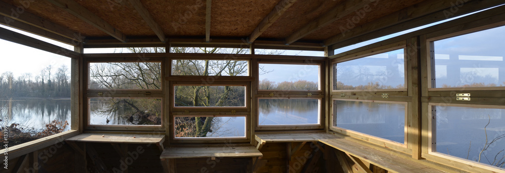 Bird watching hide looking out on to nature reserve water. Stock Photo ...