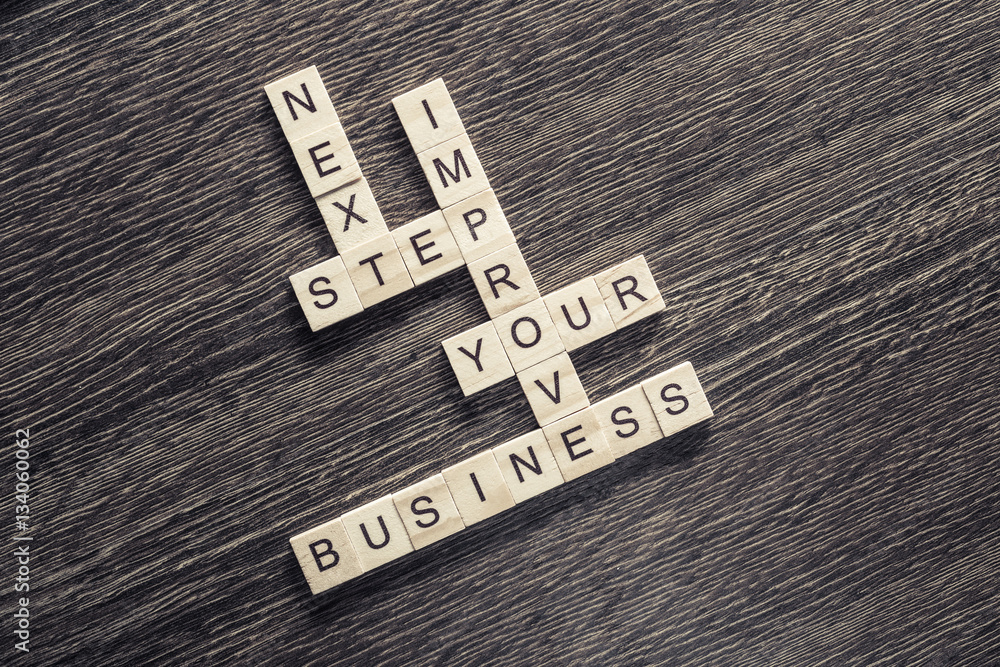 Conceptual business keywords on table with elements of game making ...