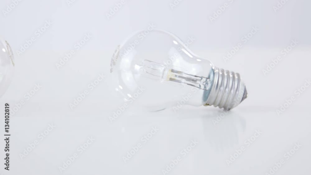 Two light bulbs on whte background 4K Stock Video | Adobe Stock