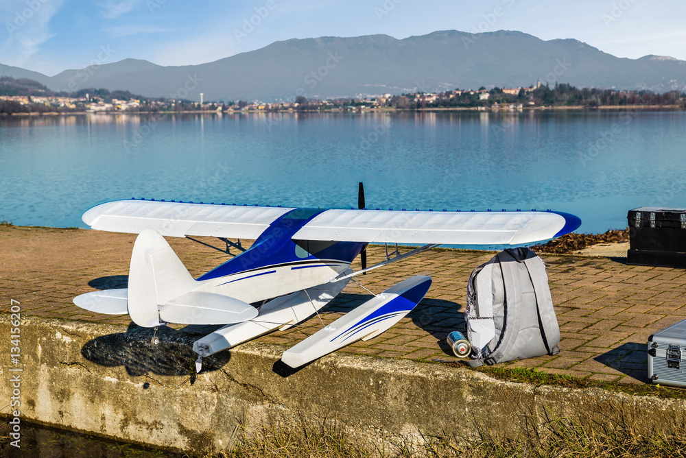 Radio controlled model seaplane. Float plane on the shore of a lake ...