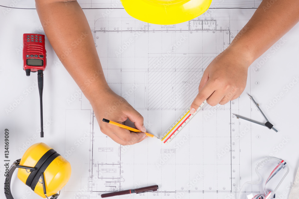 Mechanical engineer at work. Technical drawings. Paper with technical ...