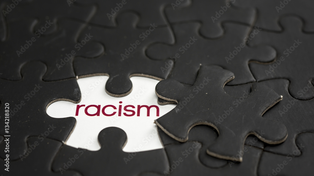 Word racism under jigsaw puzzle piece Stock Photo | Adobe Stock