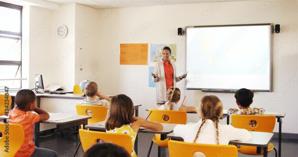 Teacher teaching kids in classroom Stock Video | Adobe Stock