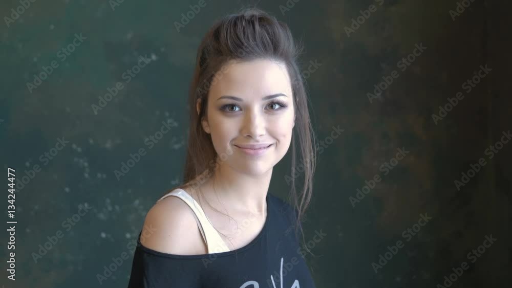 Beautiful young girl smiling at the camera. Stock Video | Adobe Stock