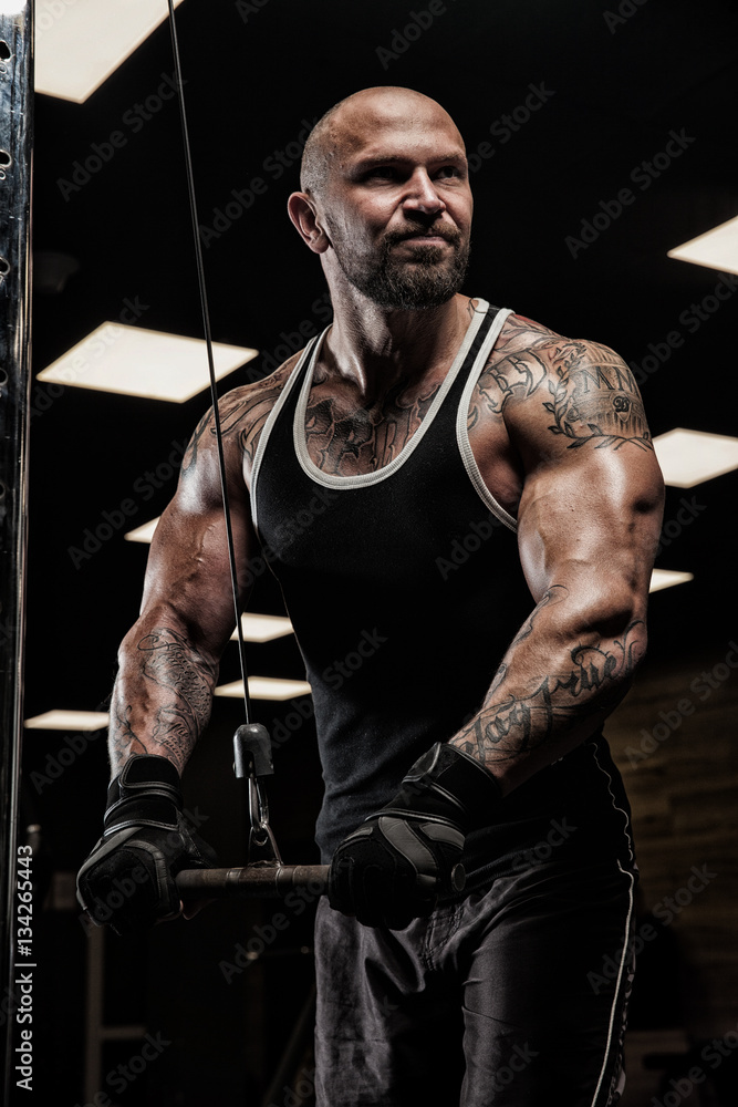 Brutal strong athletic men pumping up muscles workout bodybuilding ...