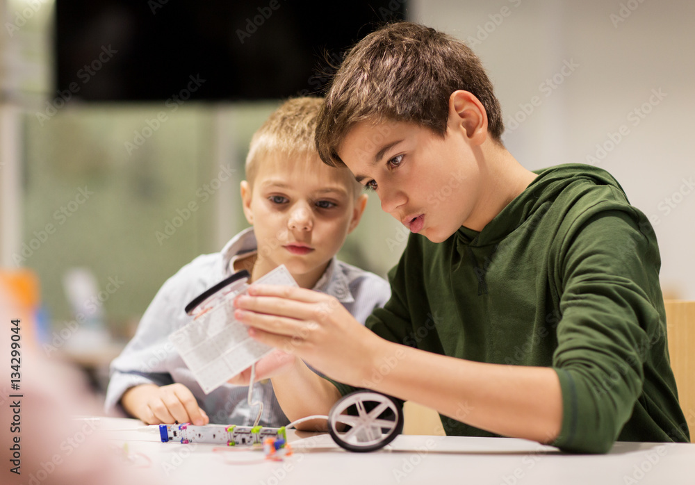 happy children building robots at robotics school Stock Photo | Adobe Stock