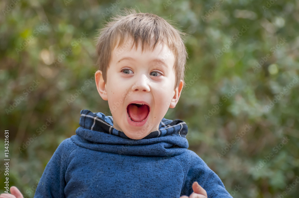Little happy 4 year old Caucasian boy clapping his hands and jumping ...