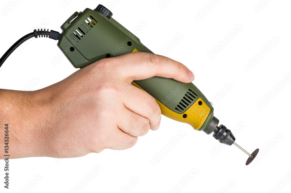 Portable engraving machine in hand Stock Photo | Adobe Stock