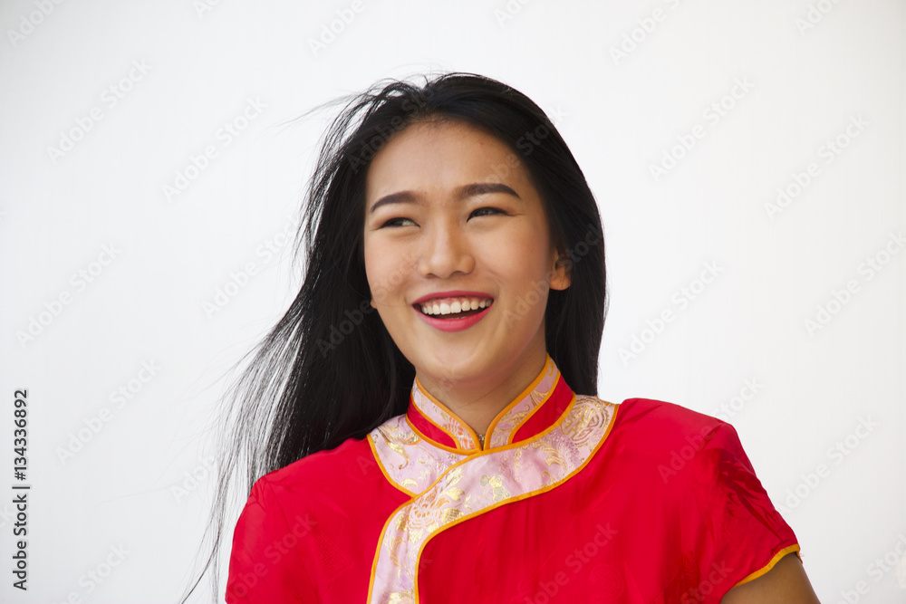 Chinese woman in traditional costume is smiling on Chinese New Year ...