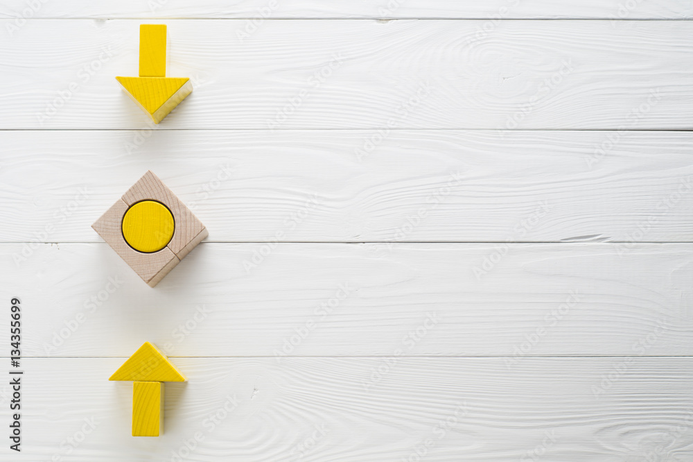 Symbol of goal and objective. Two wooden arrows converge towards the ...