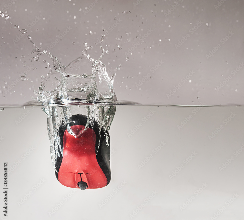 Computer mouse dropped in water Stock Photo | Adobe Stock