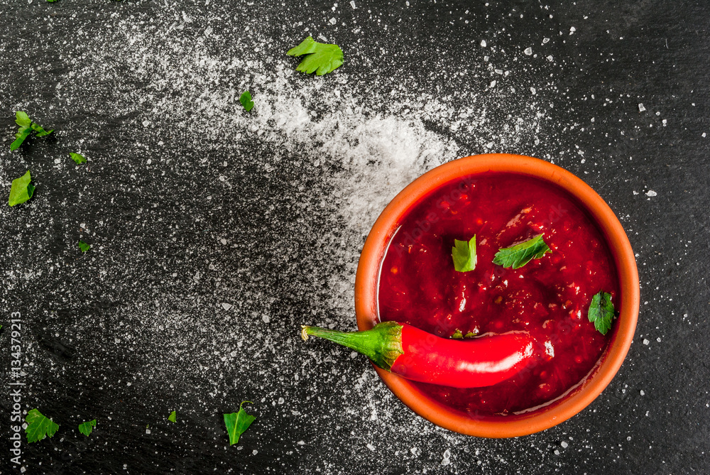 Hot Tabasco sauce in a bowl, top view. With ingredients - a slice of ...