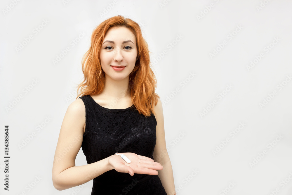 Beautiful young smiling girl with long hair holding a female swab ...
