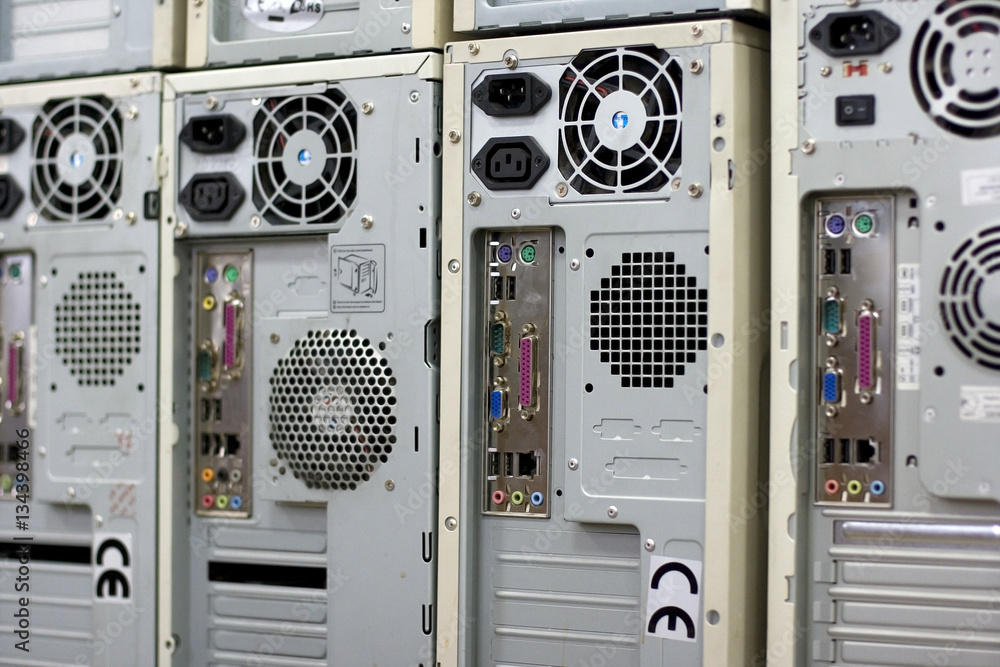 Rows of back lanes of standard desktop computers with various ...
