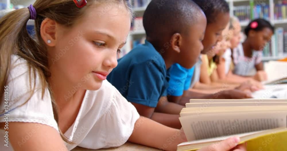 School kids reading book in library at school 4k Stock Video | Adobe Stock