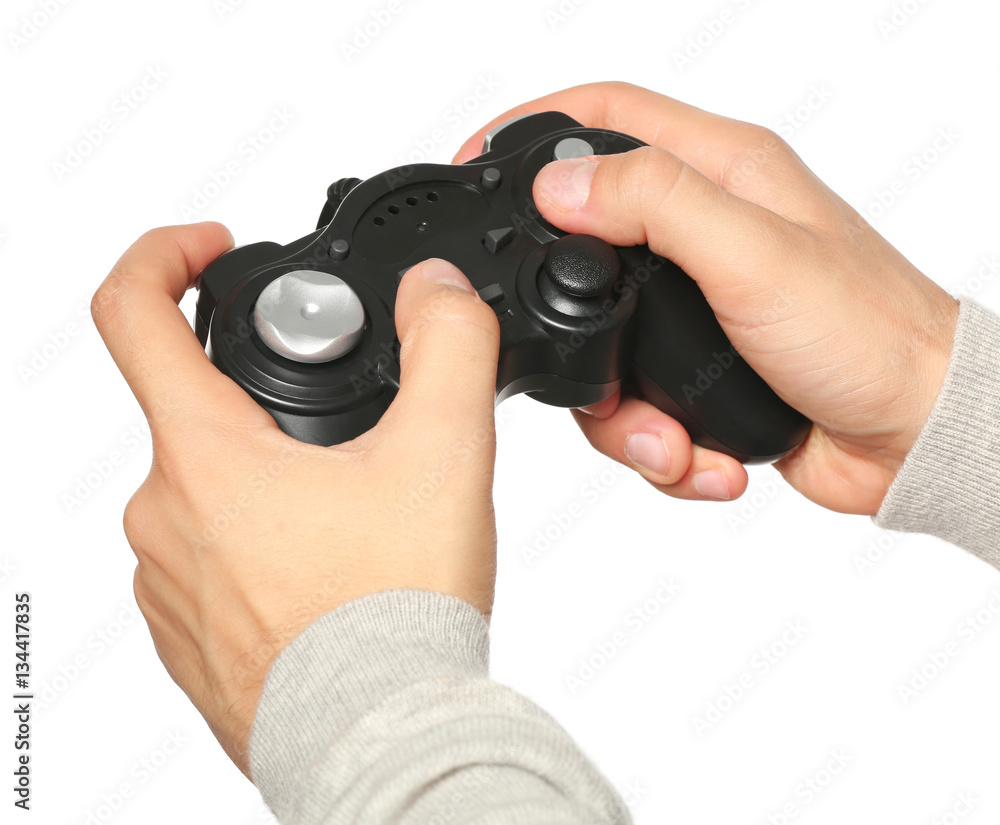 Hands of teenager with game controller on white background, closeup ...