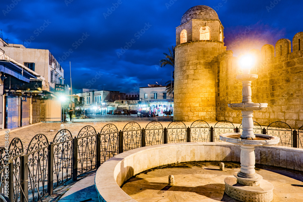 Night photo of Mosque in Sousse. Medieval architecture in night lights ...