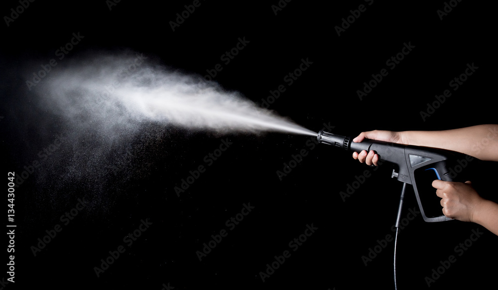 Water splashes with high pressure water jet on black background Stock ...