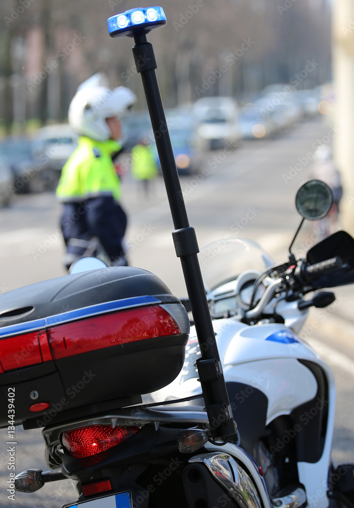 motorcycle police with flashing siren and a traffic officer on t Stock ...