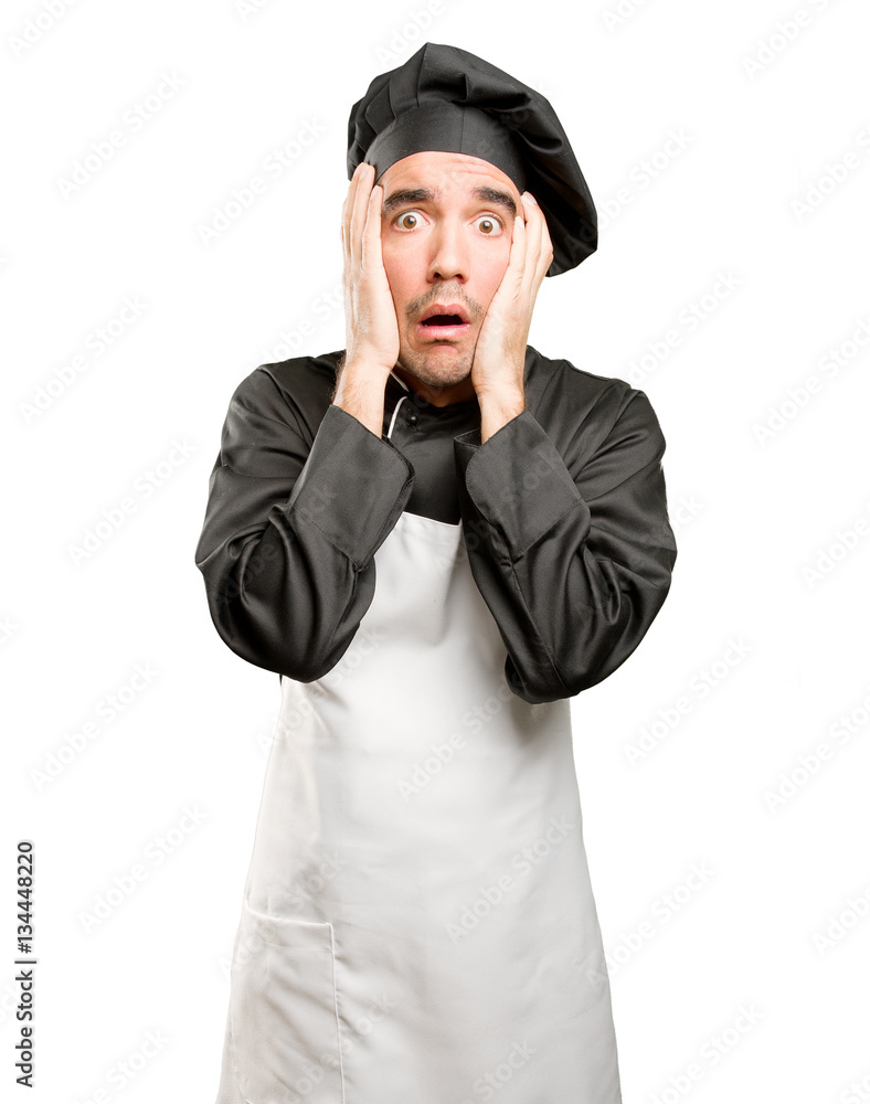 Depressed young chef posing foto de Stock | Adobe Stock