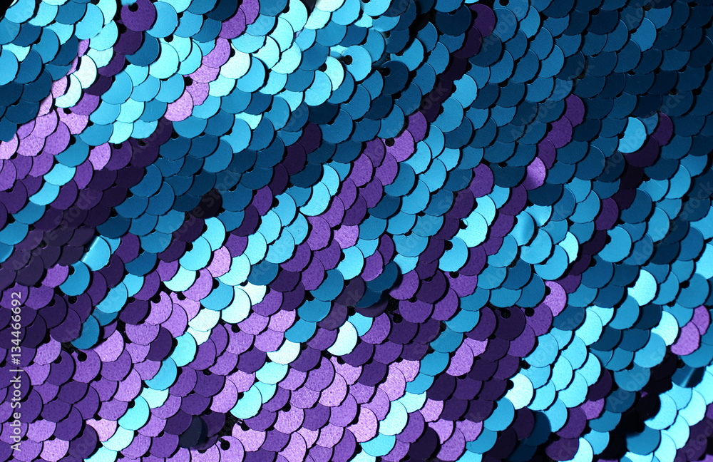 Sequins close-up macro. Abstract background with blue sequins and lilac ...