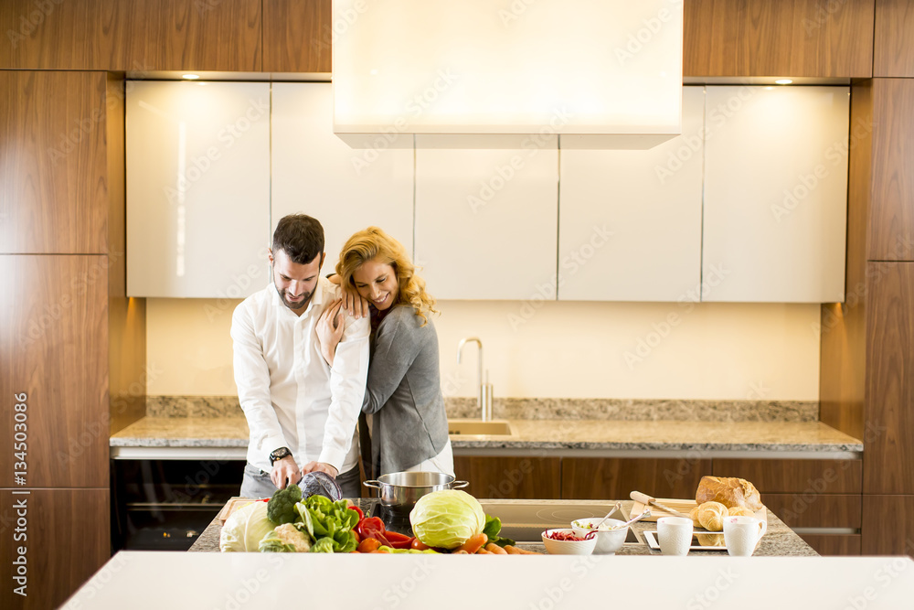 Loving couple in the modern kitchen Stock Photo | Adobe Stock