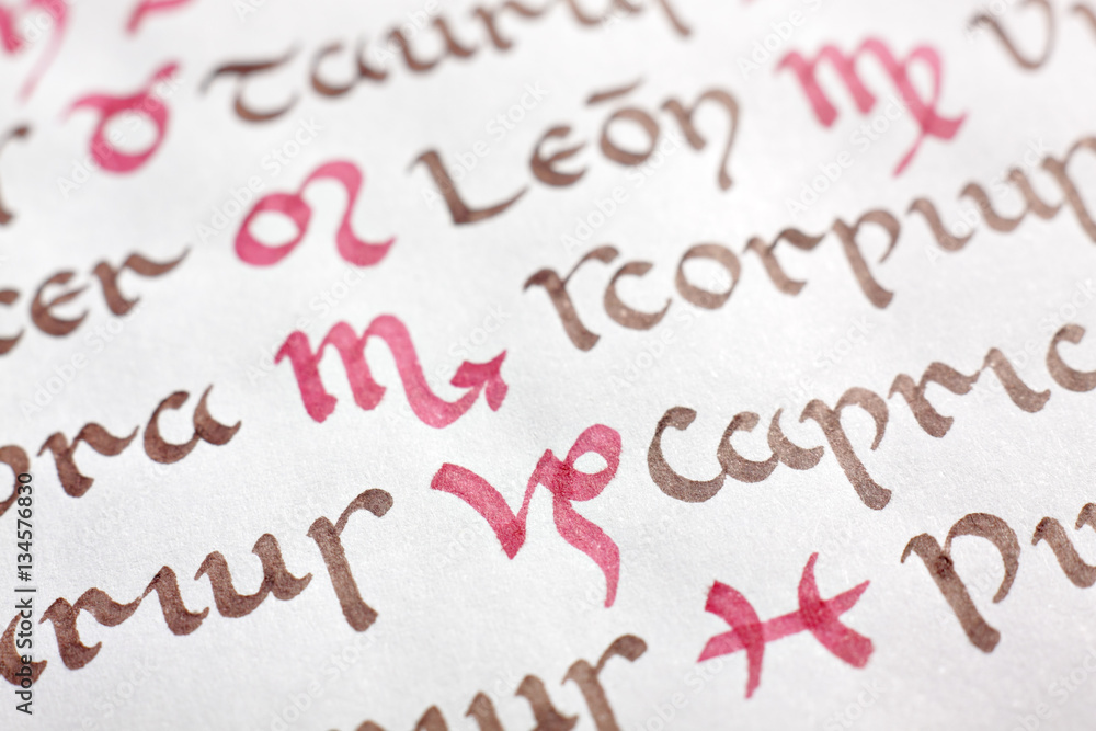 Detail of a handwritten zodiacal symbols. Uncial latin script. Stock ...