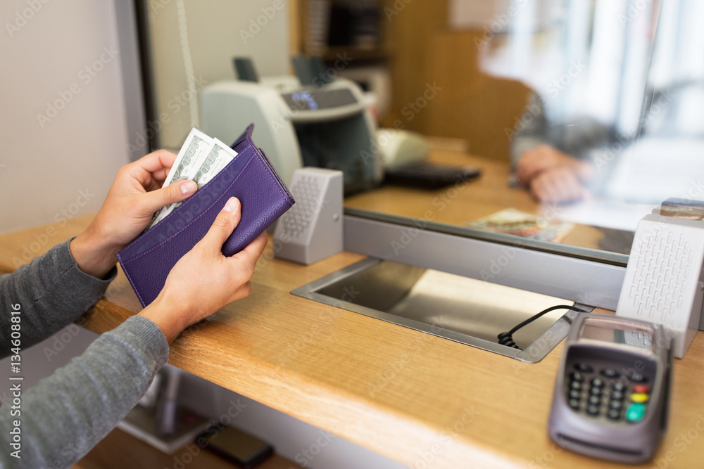 Foto Stock hands with money at bank or currency exchanger | Adobe Stock